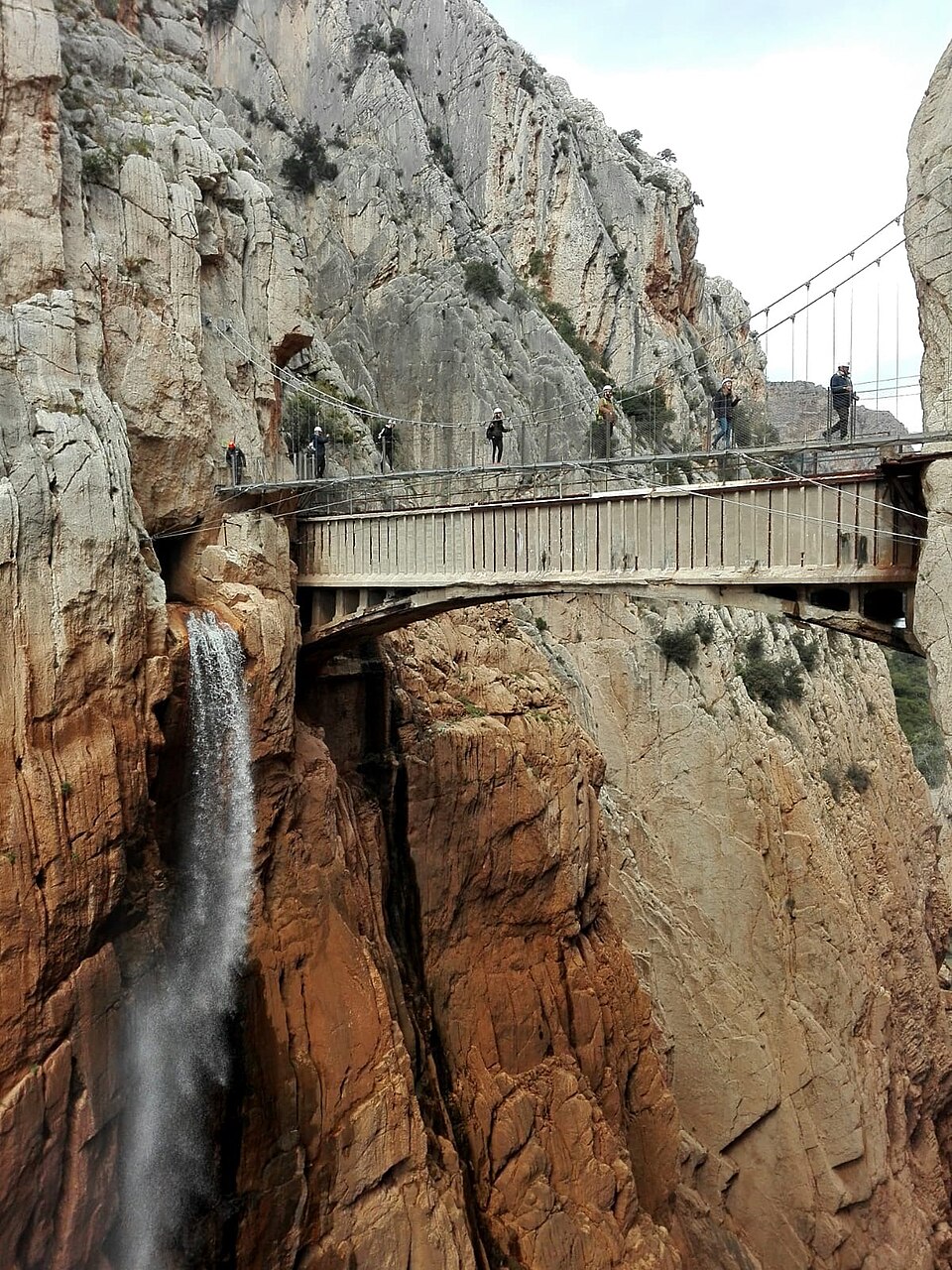 The new suspension bridge spanning the gorge at Caminito del Rey with walkers crossing