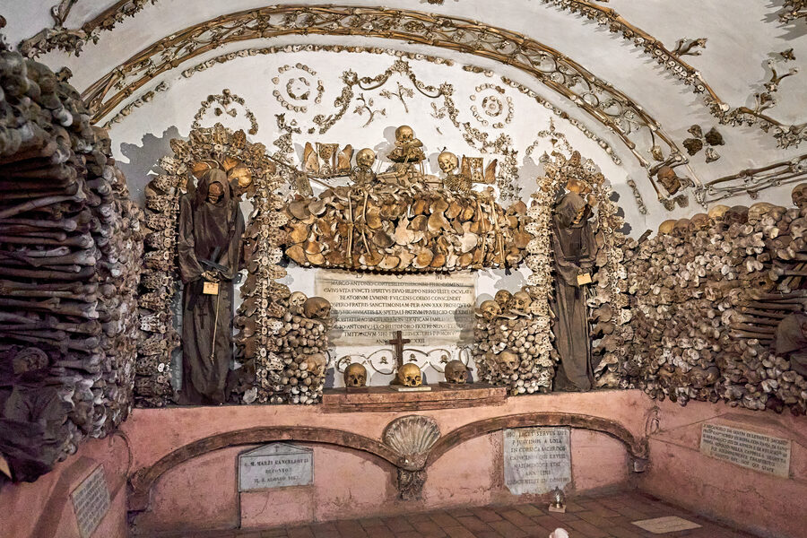 Detailed view of monks bones arranged into decorative patterns on the walls and arches of the Capuchin Crypt in Rome