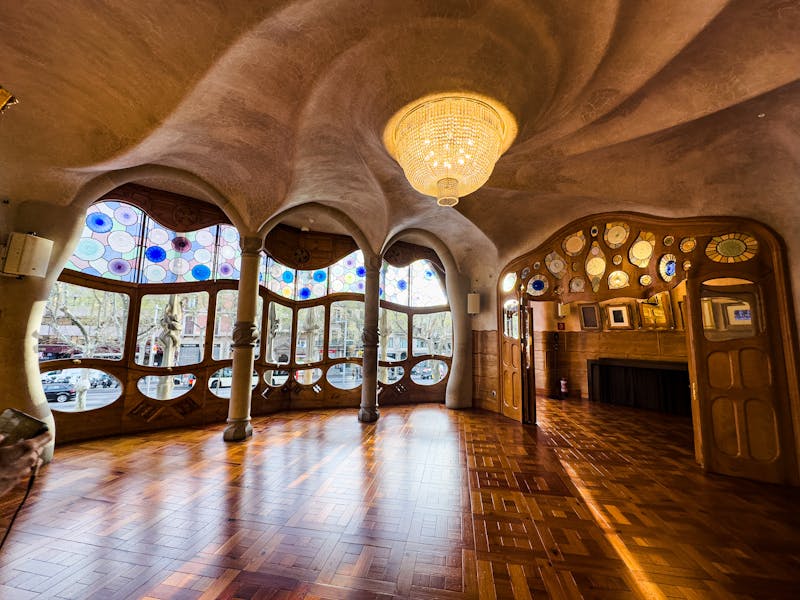 Interior staircase and hallway of Casa Batllo with smooth organic walls and natural light
