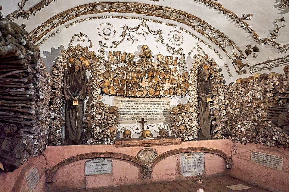 Elaborate bone and skull decorations forming chandeliers and patterns in the Capuchin Crypt in Rome
