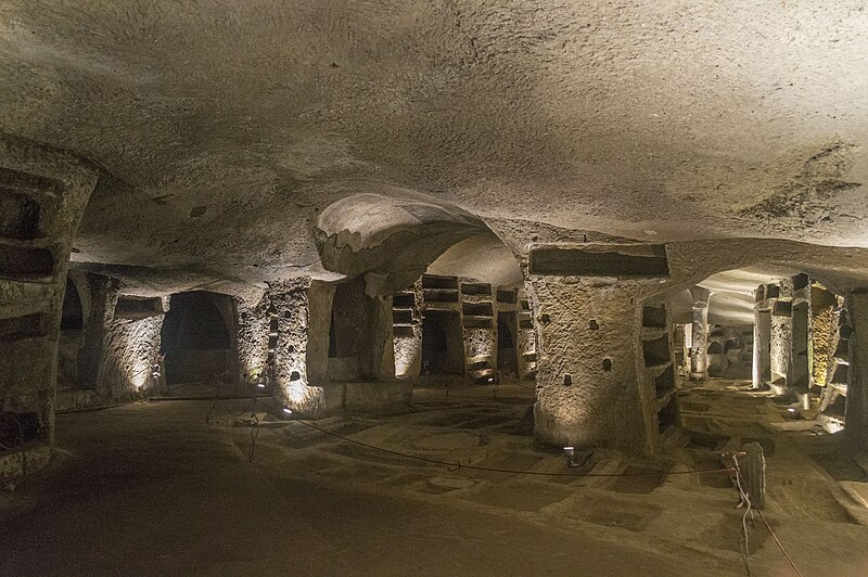Ancient frescoes and stone passages inside Catacombs of San Gennaro in Naples