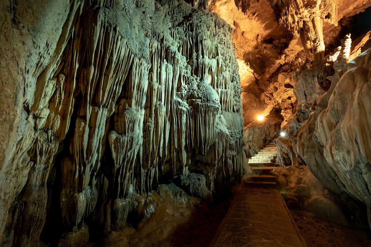 Wide view of cave interior showing various stalactite and stalagmite formations