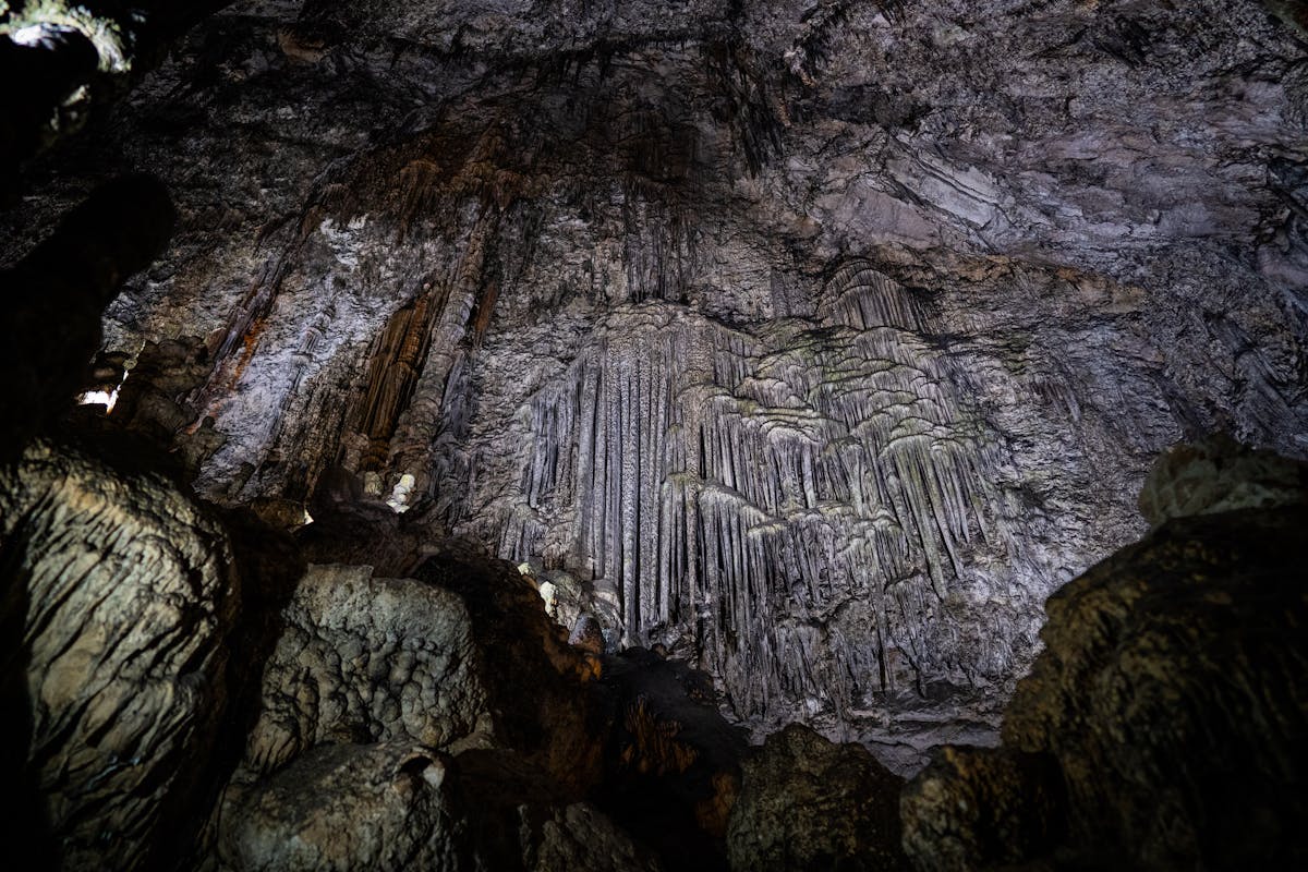Karst formations inside the Caves of Drach in Majorca with illuminated stalactites