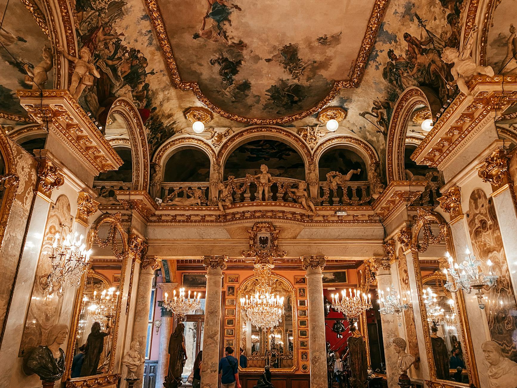 Luxurious baroque-style interior of the Cerralbo Museum in Madrid with chandeliers and period furniture