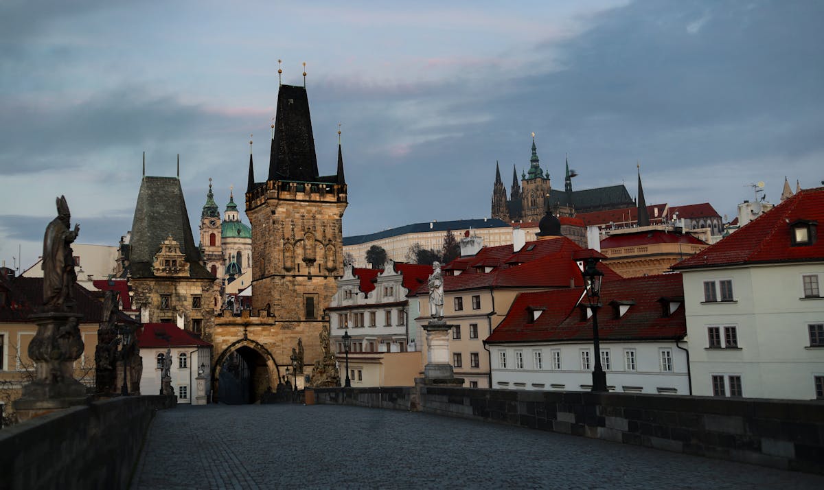 Picturesque view of Charles Bridge in Prague with its iconic towers at dawn