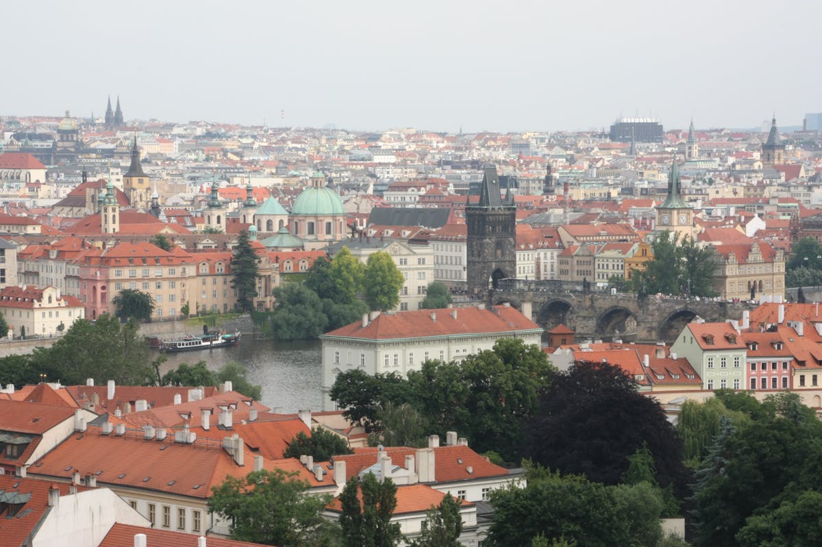 Aerial view of Prague featuring Charles Bridge and historic Old Town