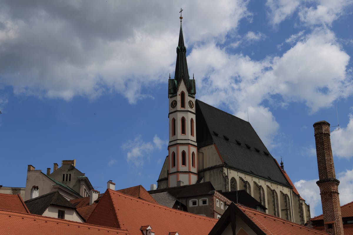 St Vitus Church tower rising above the red rooftops of Cesky Krumlov
