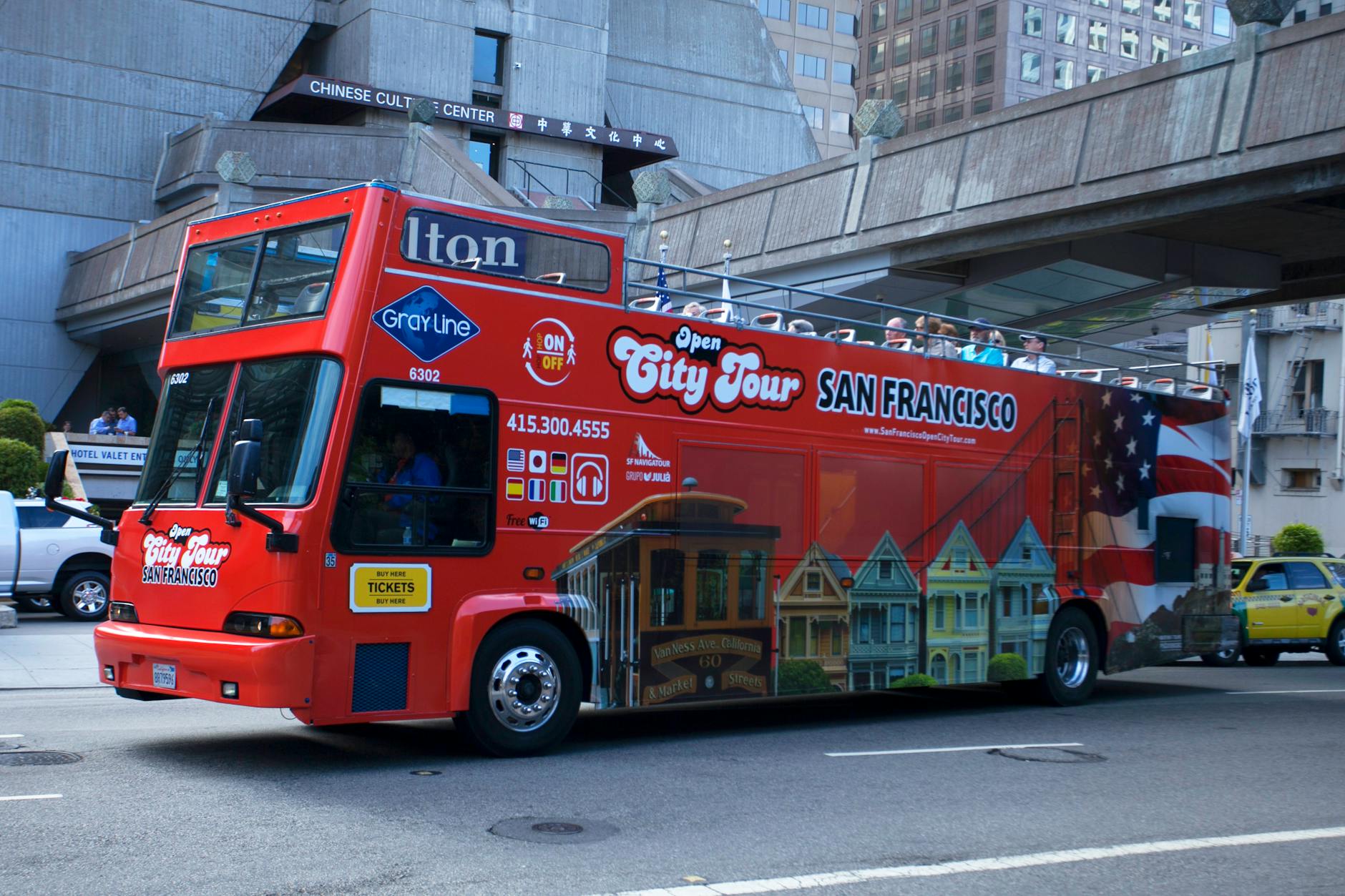 Red city sightseeing open top double decker tour bus