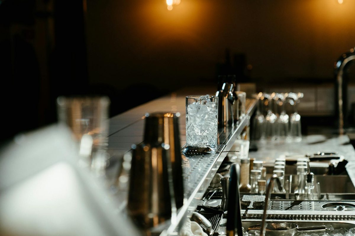 Bar counter with cocktail preparation tools and ice