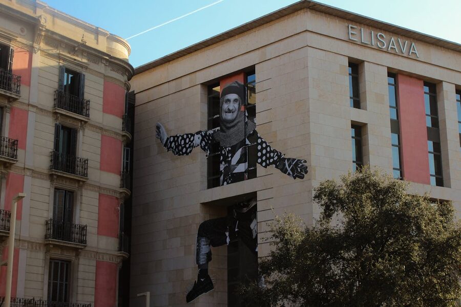 Colorful street art on the facade of a building in Barcelona showcasing urban creativity
