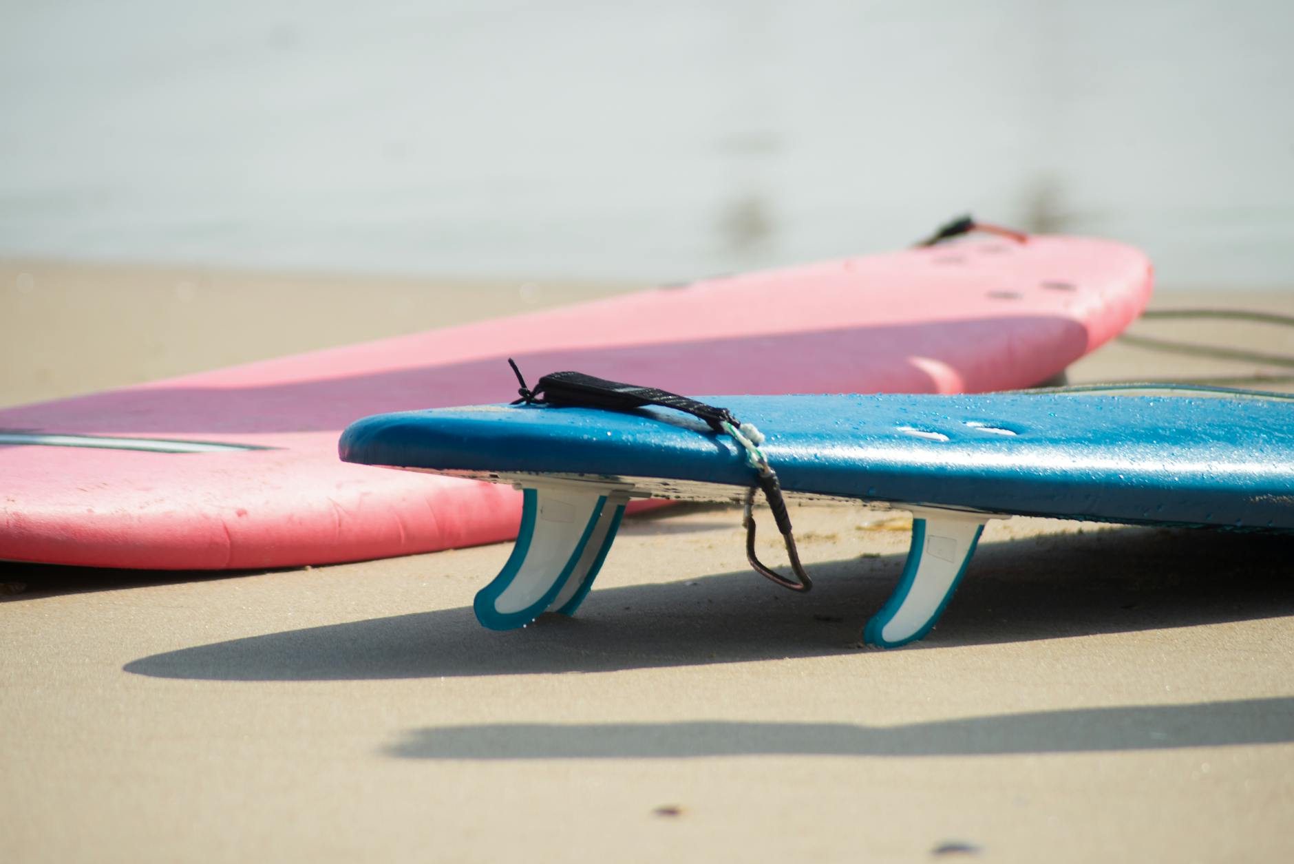 Colorful surfboards on a sandy beach