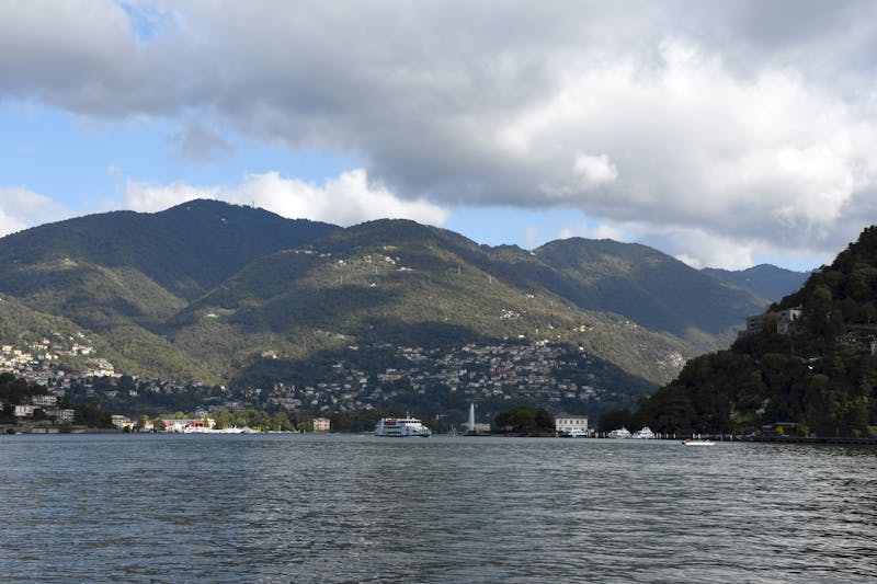 Panoramic view of Lake Como surrounded by mountains in Lombardy Italy