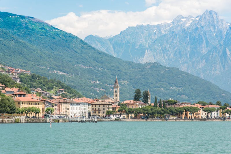 Lake Como shoreline town with the Italian Alps rising behind it