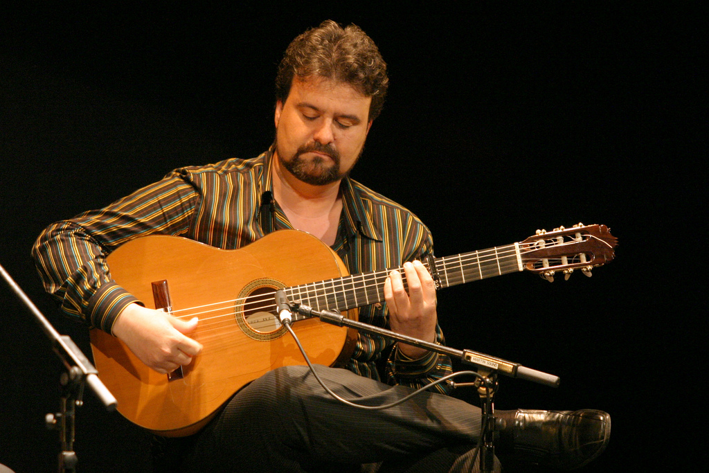 Flamenco guitarist performing at the Concurso Nacional de Arte Flamenco in Cordoba