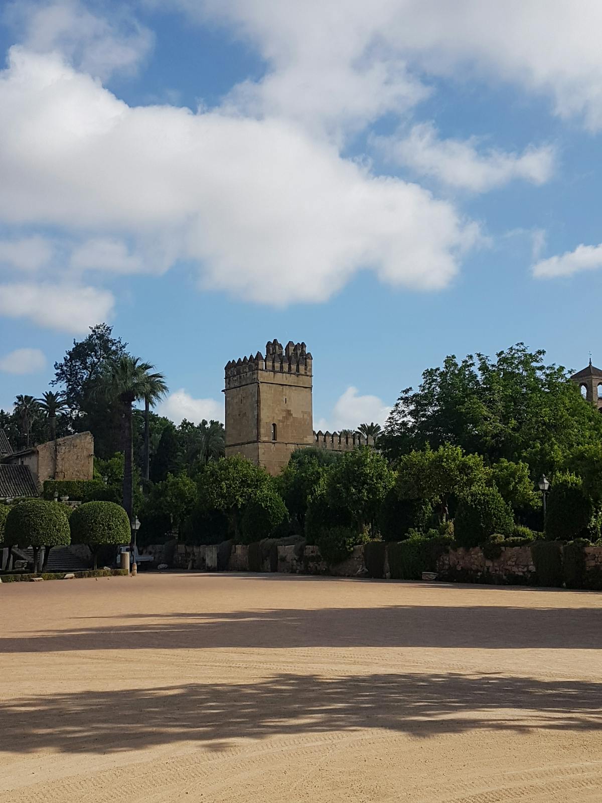 Historic Alcazar fortress in Cordoba Spain under blue sky