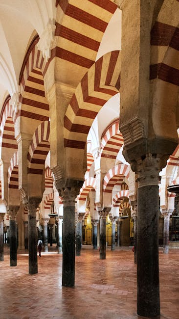 Red and white arched hallway inside the Cordoba Mezquita
