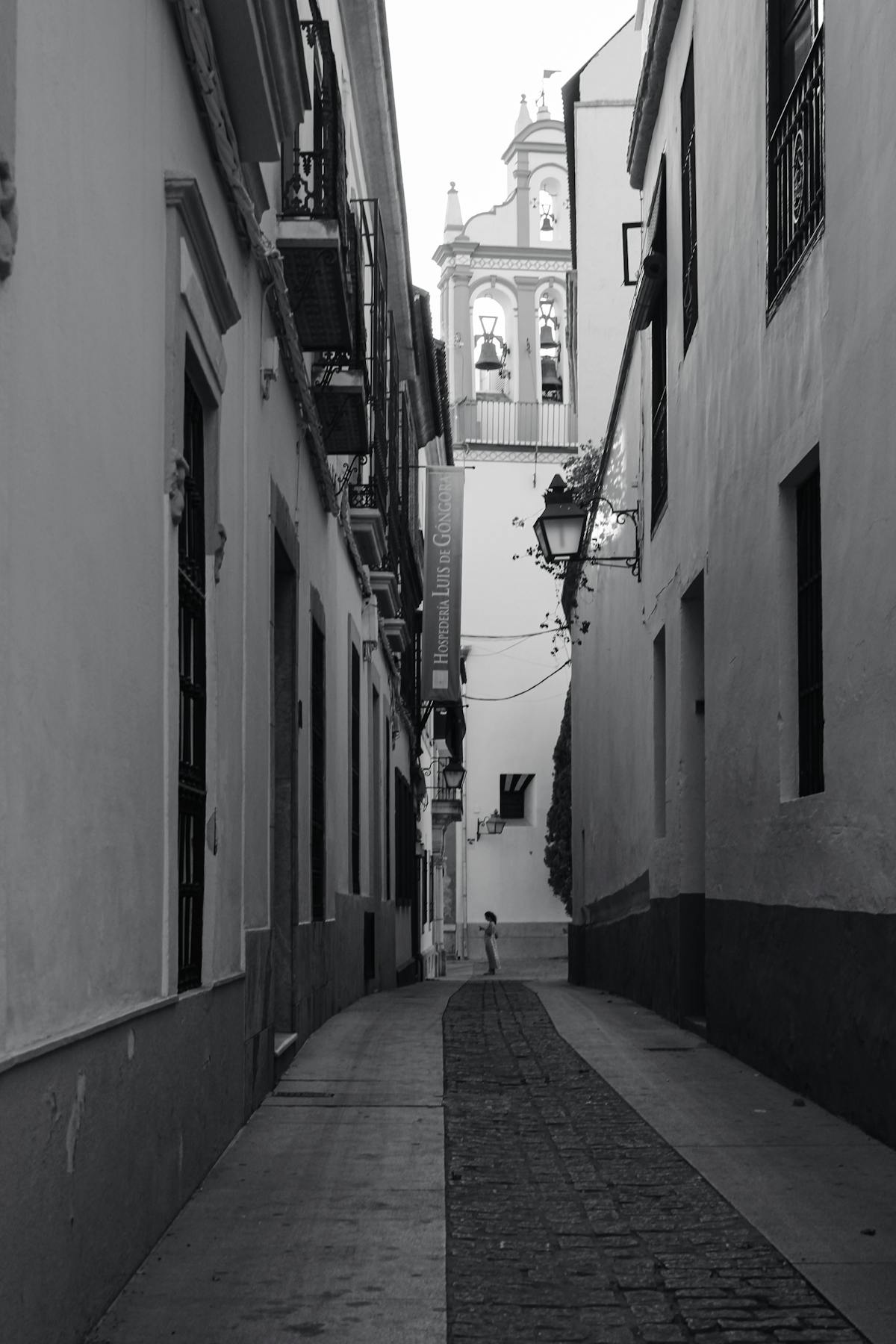 Historic narrow street in Cordoba with traditional architecture