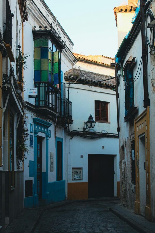 Narrow street with colorful balconies in the old town of Cordoba