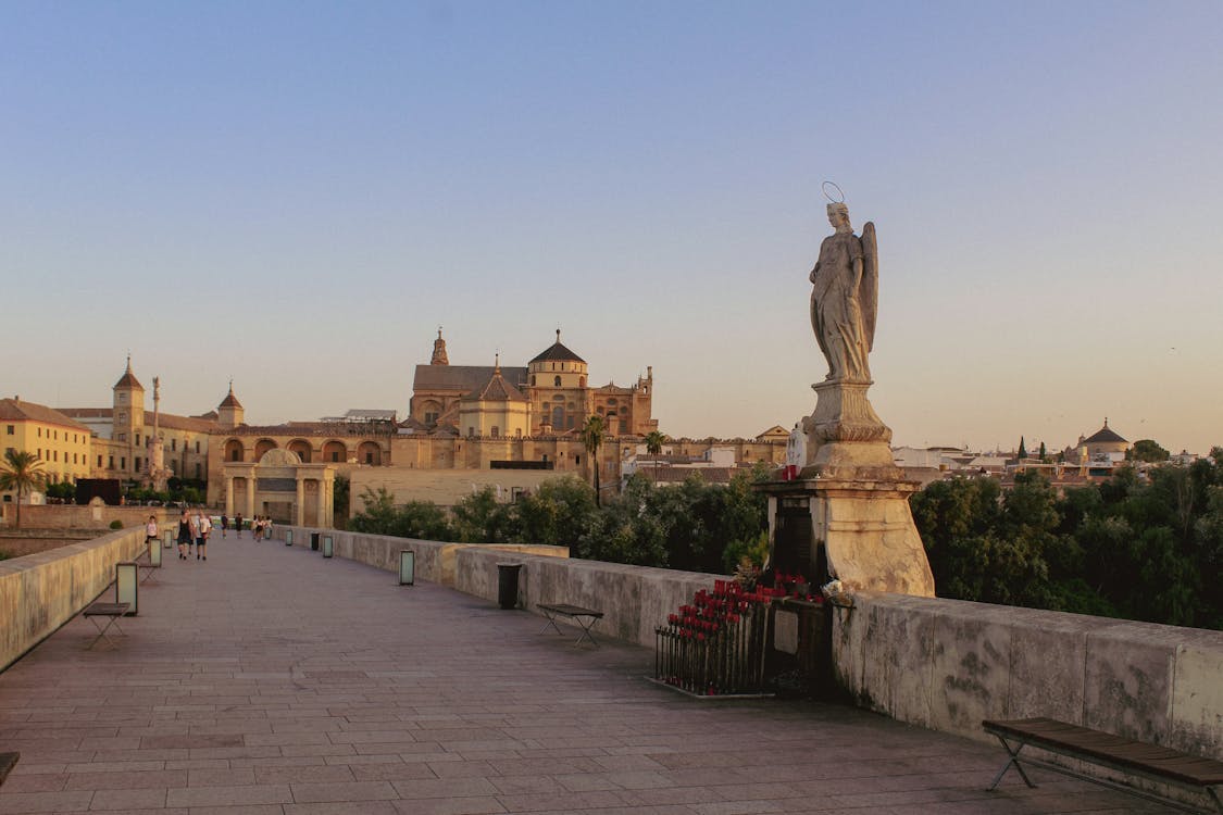 Roman Bridge of Cordoba with Mosque-Cathedral in background at sunset