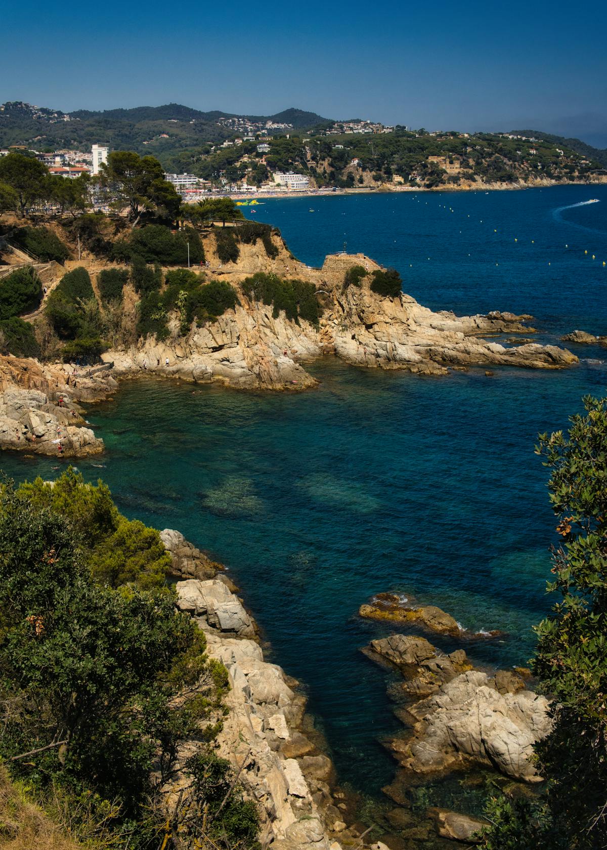 Aerial view of the rocky Costa Brava coastline with clear blue water