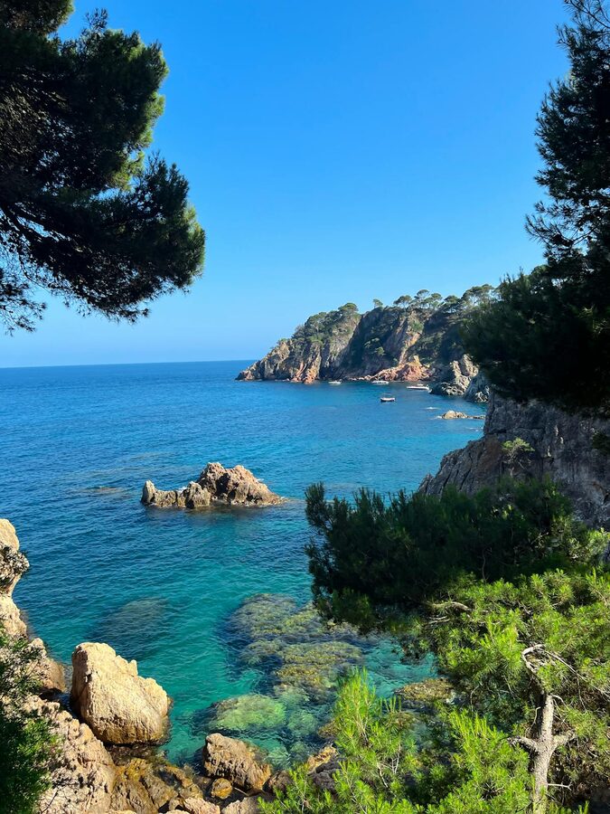 Breathtaking seaside landscape of Costa Brava with clear blue waters and rocky cliffs