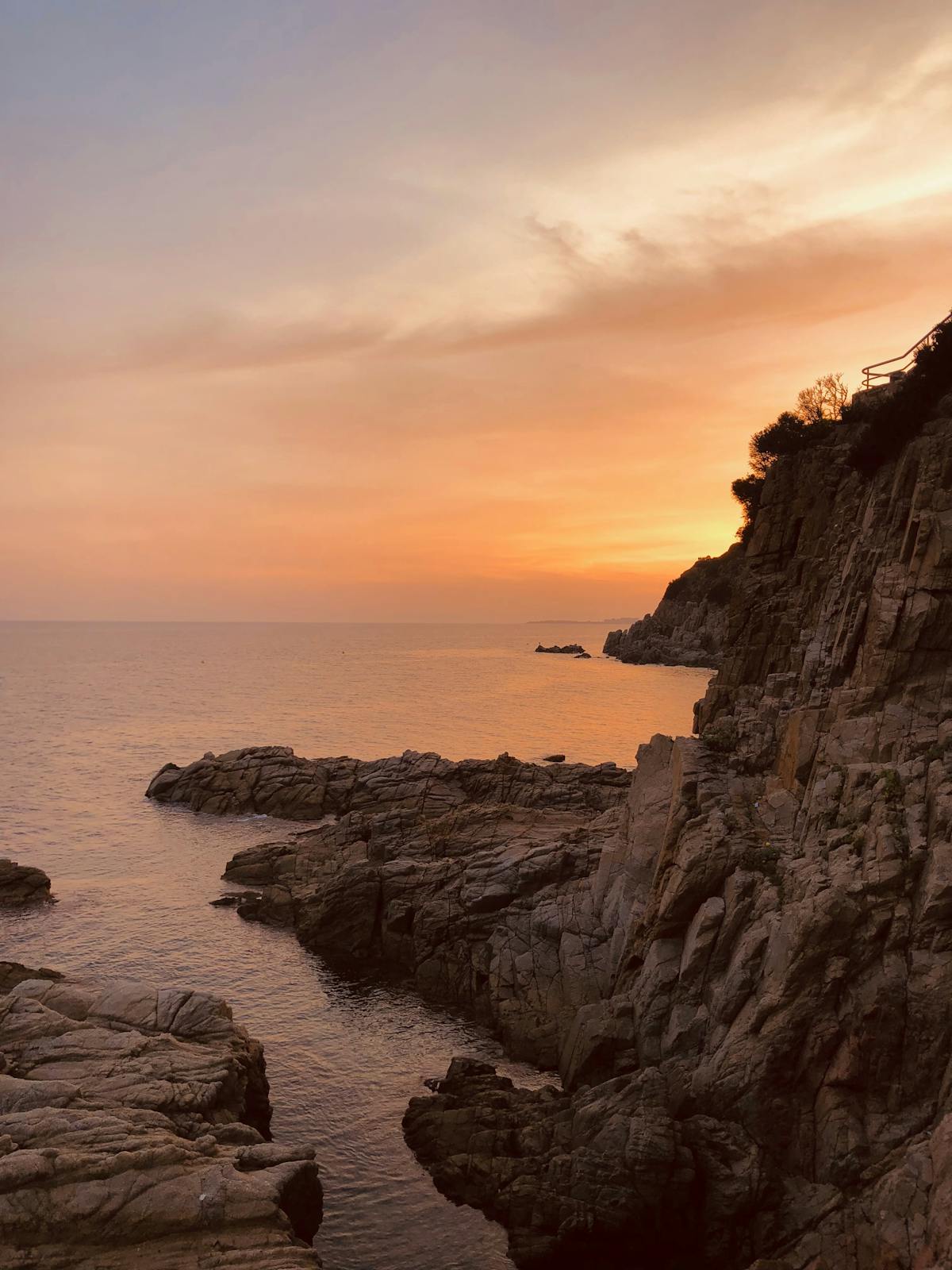 Dramatic sunset over the Costa Brava rocky coastline
