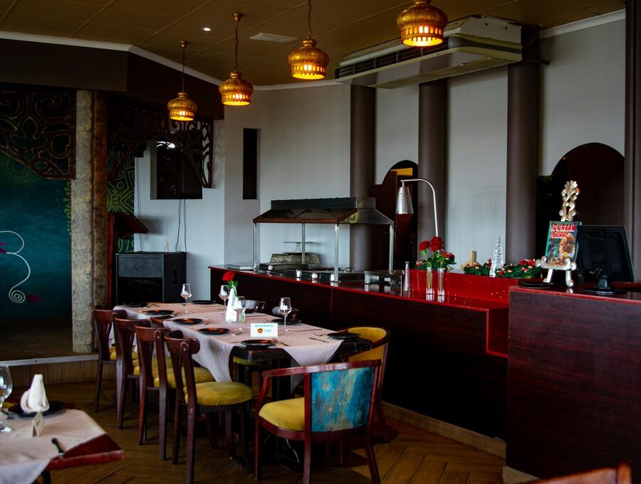 Cozy restaurant interior with warm lighting and wooden furniture