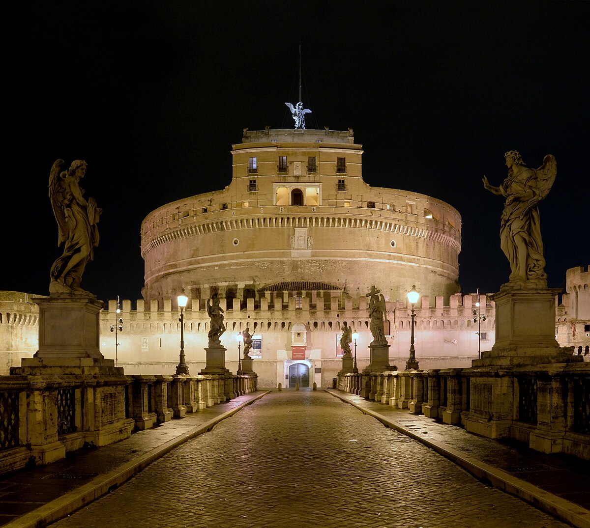 Castel Sant Angelo and bridge illuminated at night in Rome