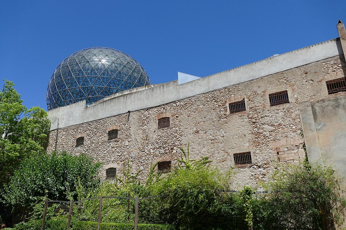 The geodesic glass dome of the Dali Theatre-Museum seen from inside the courtyard