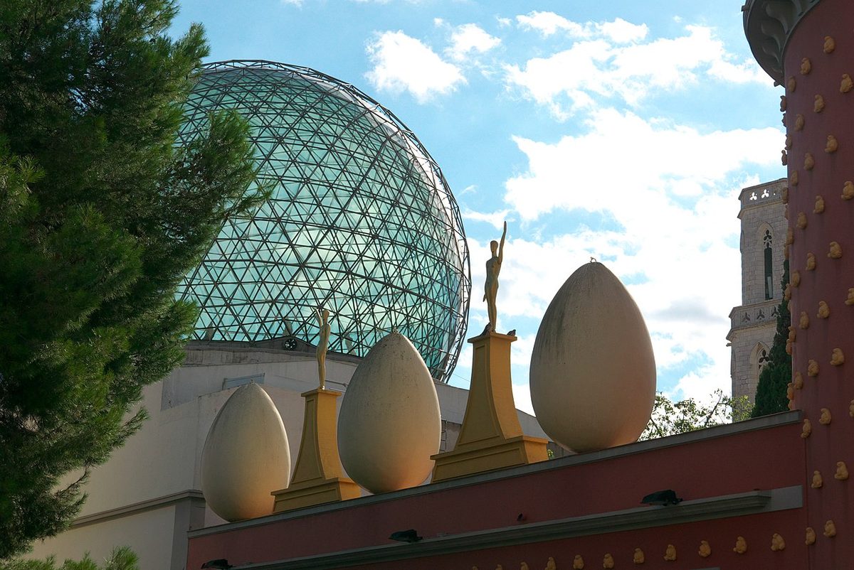 Wide view of the Dali Theatre-Museum building in Figueres with its distinctive red walls and egg sculptures