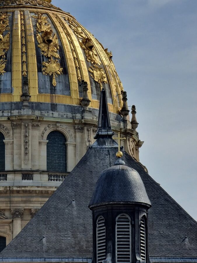 Close-up of the gilded dome of Les Invalides showing architectural detail