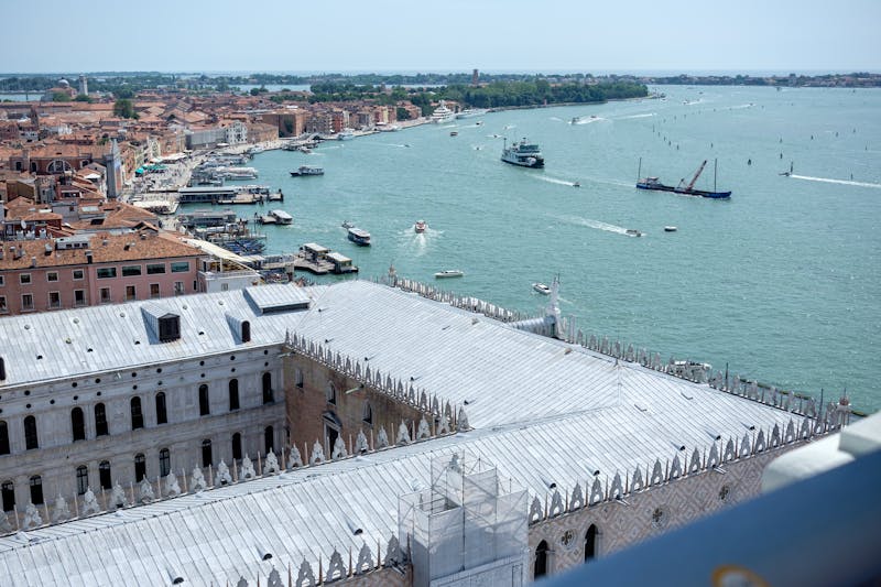 Aerial view of Doges Palace, St Marks Campanile, and Venice waterfront from above