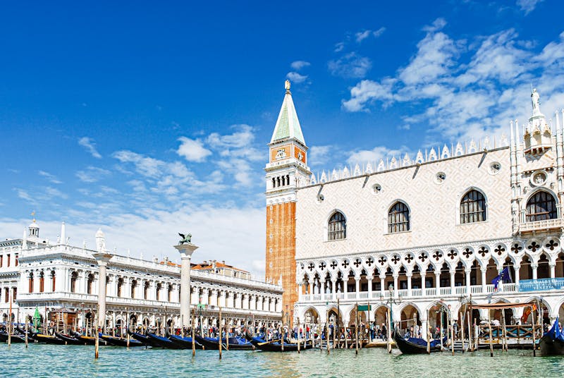 Doges Palace facade and St Marks Campanile viewed from the Grand Canal in Venice