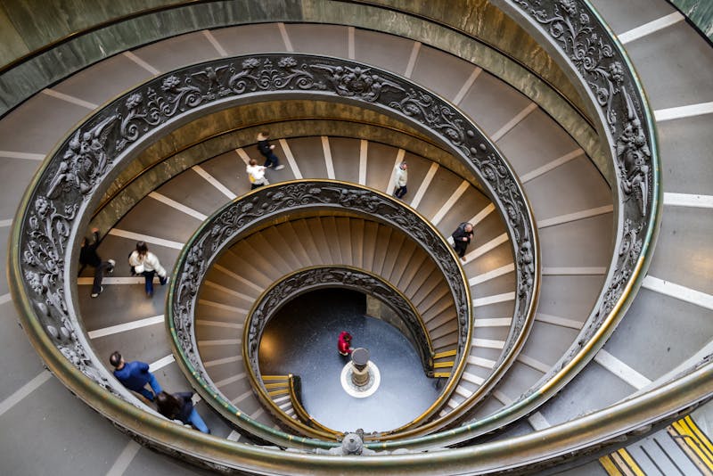 The narrow spiral staircase inside St Peter's dome with curved walls