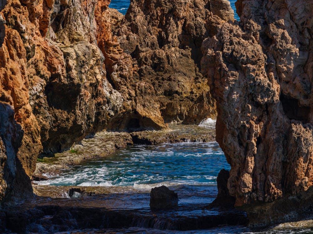 Dramatic cliffs with ocean waves crashing on rocks