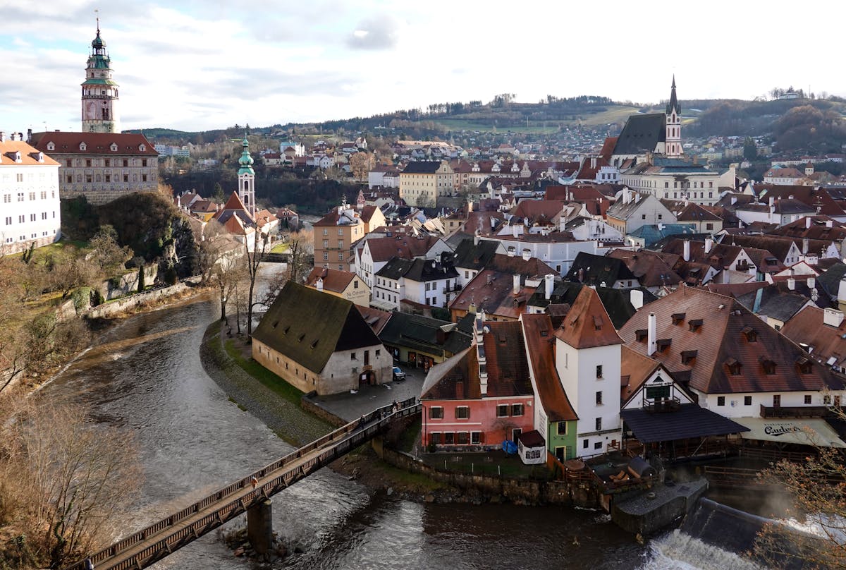Drone view of Cesky Krumlov showing the river bend and historic architecture