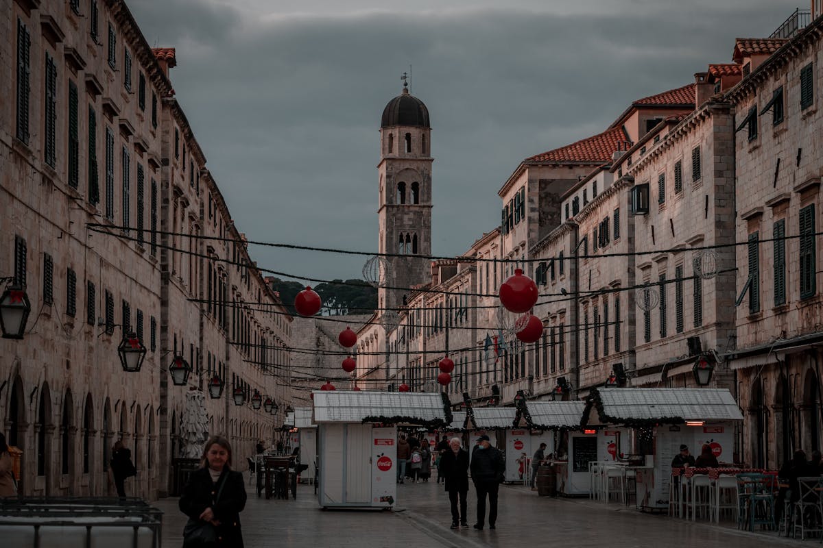 Stradun main street in Dubrovnik Old Town Croatia with historic bell tower and stone buildings