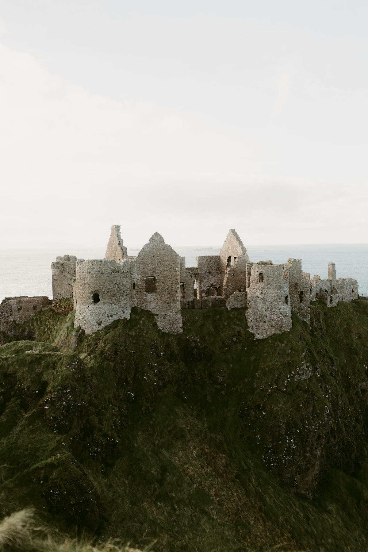 Ruins of Dunluce Castle on clifftop overlooking the North Atlantic in Northern Ireland