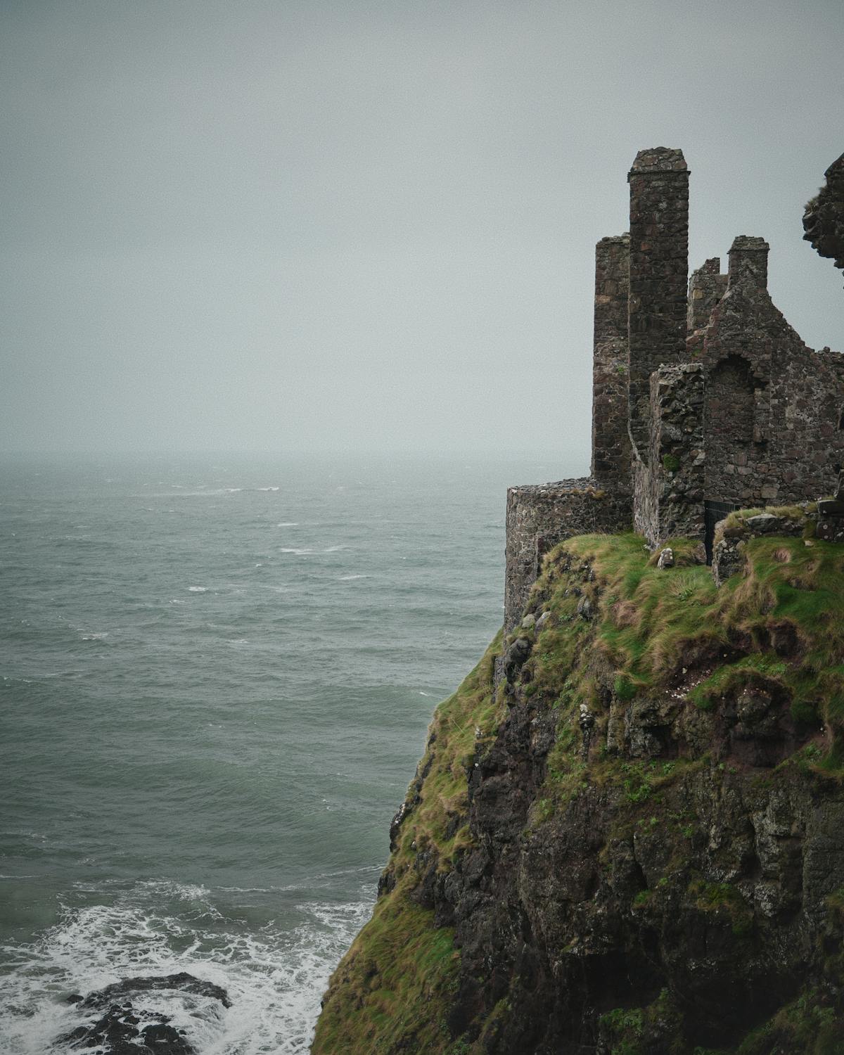 Atmospheric view of Dunluce Castle perched on cliffs above the sea