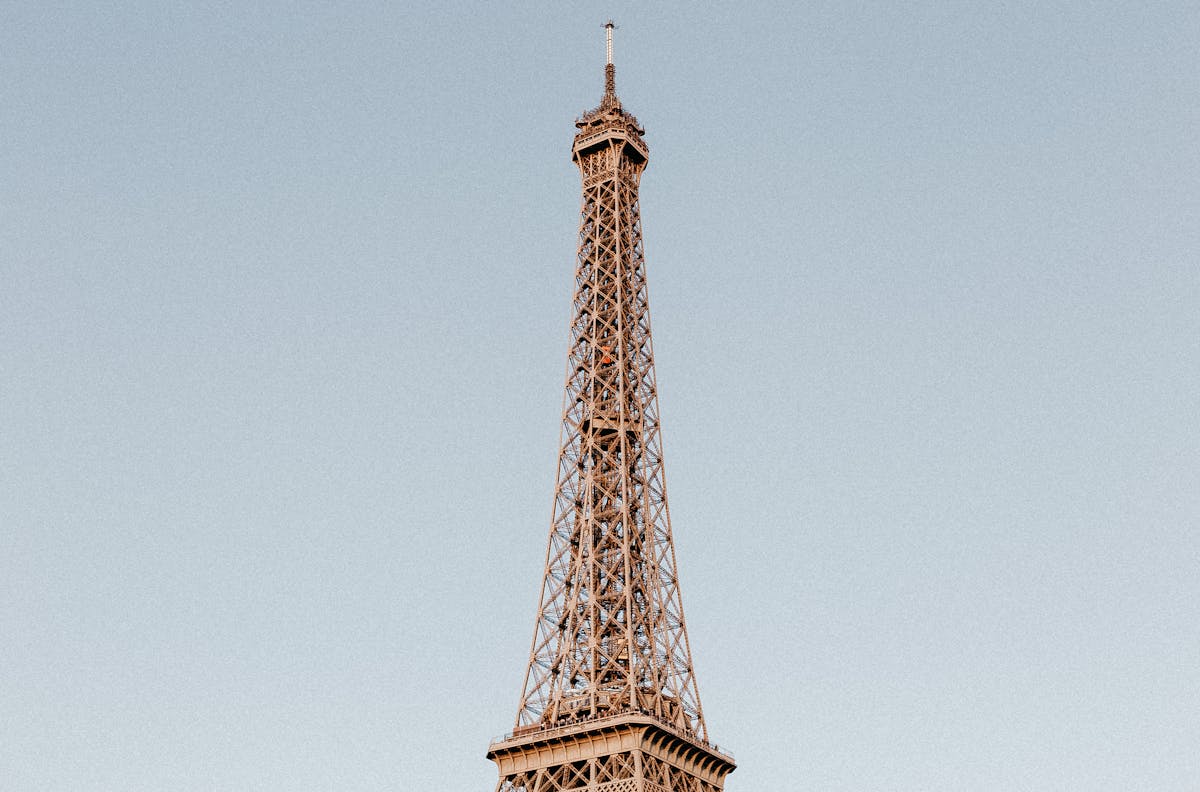 The Eiffel Tower standing tall against a clear blue sky