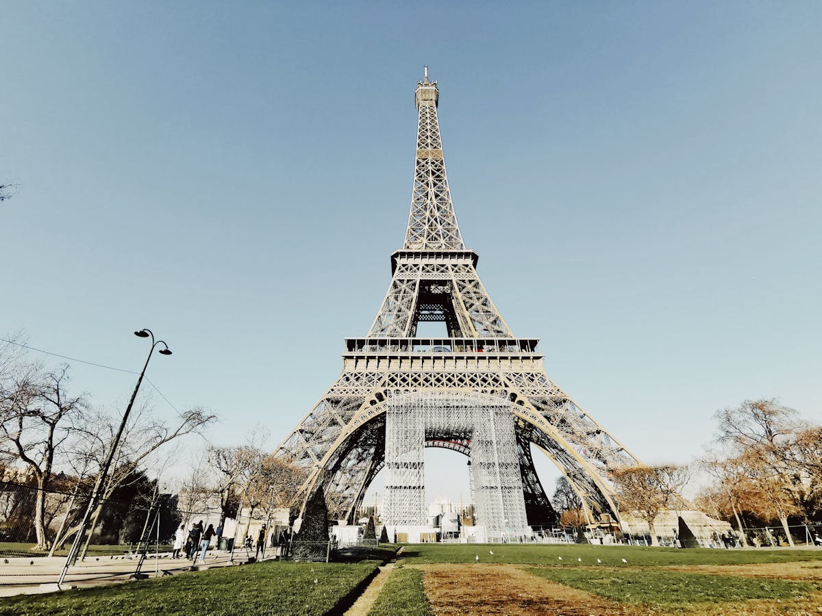Low angle view of the Eiffel Tower against a clear blue sky in Paris