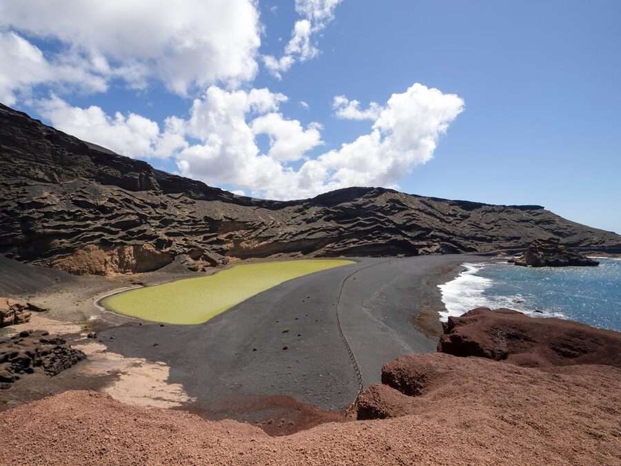 Scenic view of El Golfo green lagoon and rocky coast in Lanzarote Spain