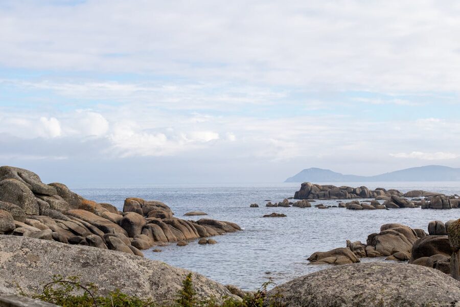 Peaceful rocky coast with clear blue sea in Galicia Spain
