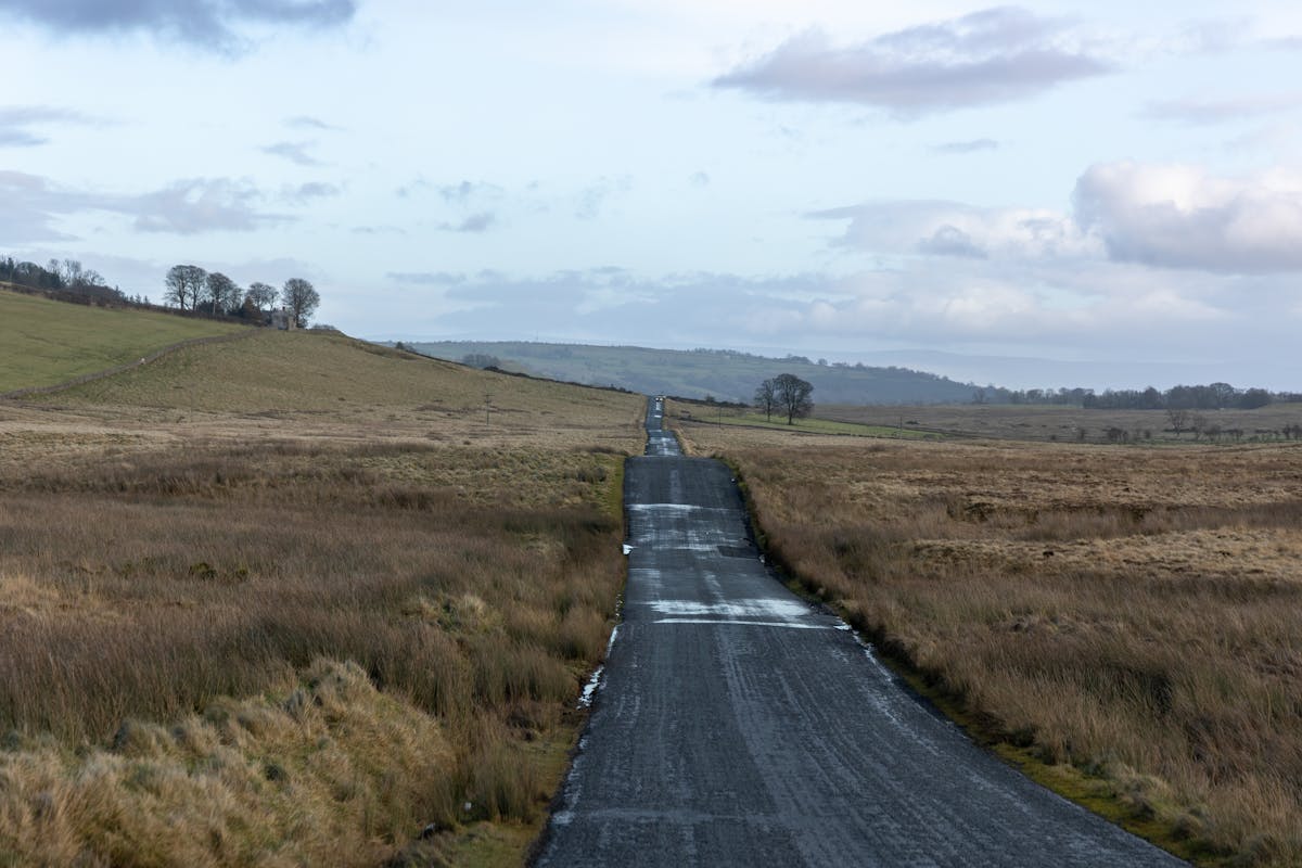 Quiet country road winding through English winter landscape