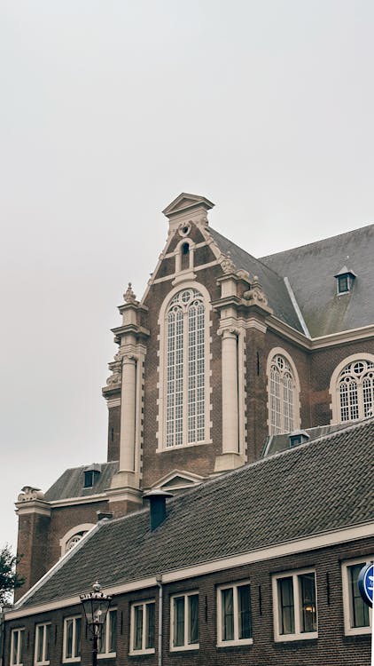 Exterior facade of the Westerkerk church in Amsterdam on an overcast day