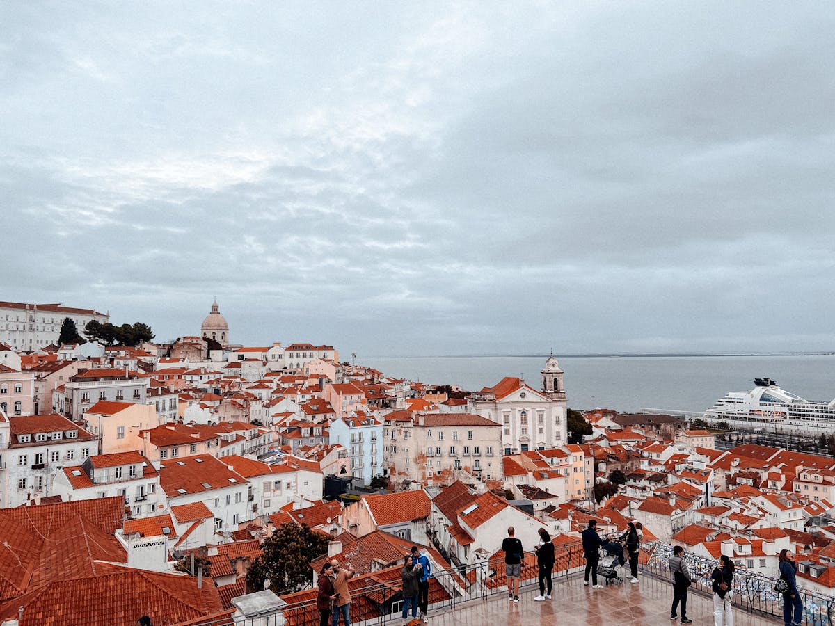 Elevated view of Lisbon historic rooftops with the sea in the background