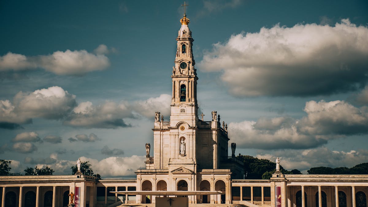 The Sanctuary of Our Lady of Fátima with dramatic cumulus clouds