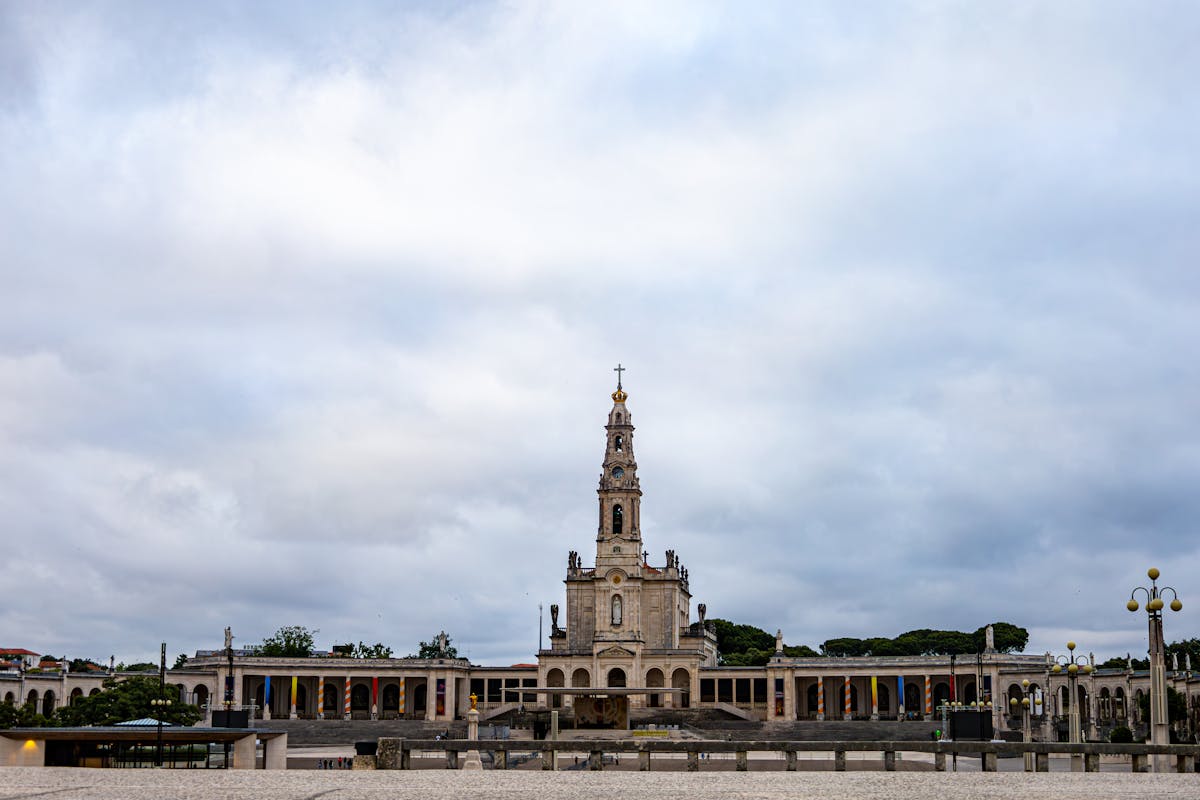 The Sanctuary of Fátima showing its impressive grounds under a cloudy sky
