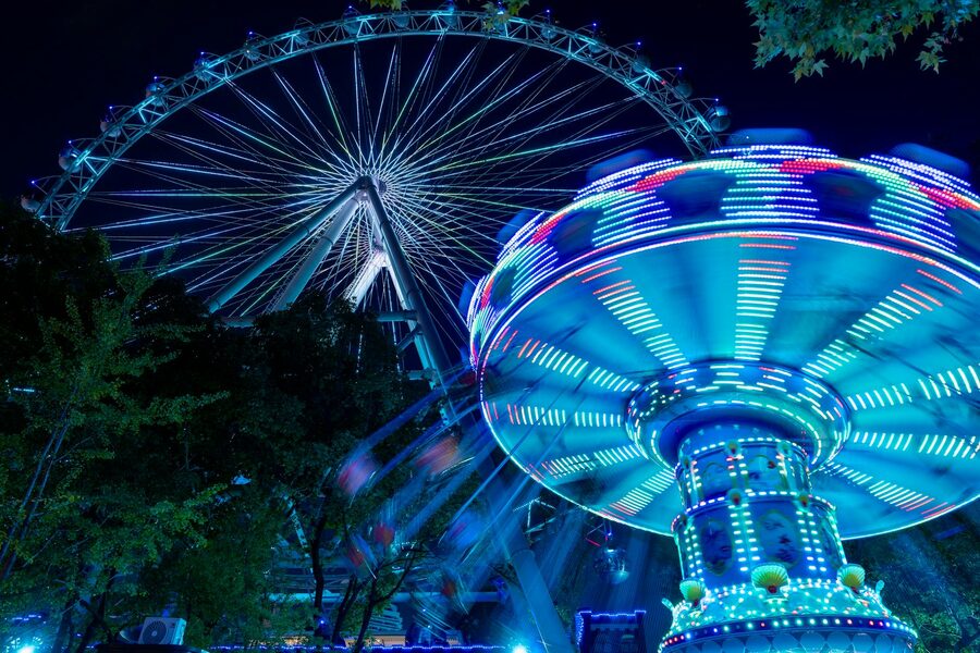 Ferris wheel with amusement park lights