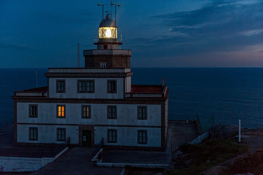 Cape Finisterre lighthouse overlooking the Atlantic Ocean at night